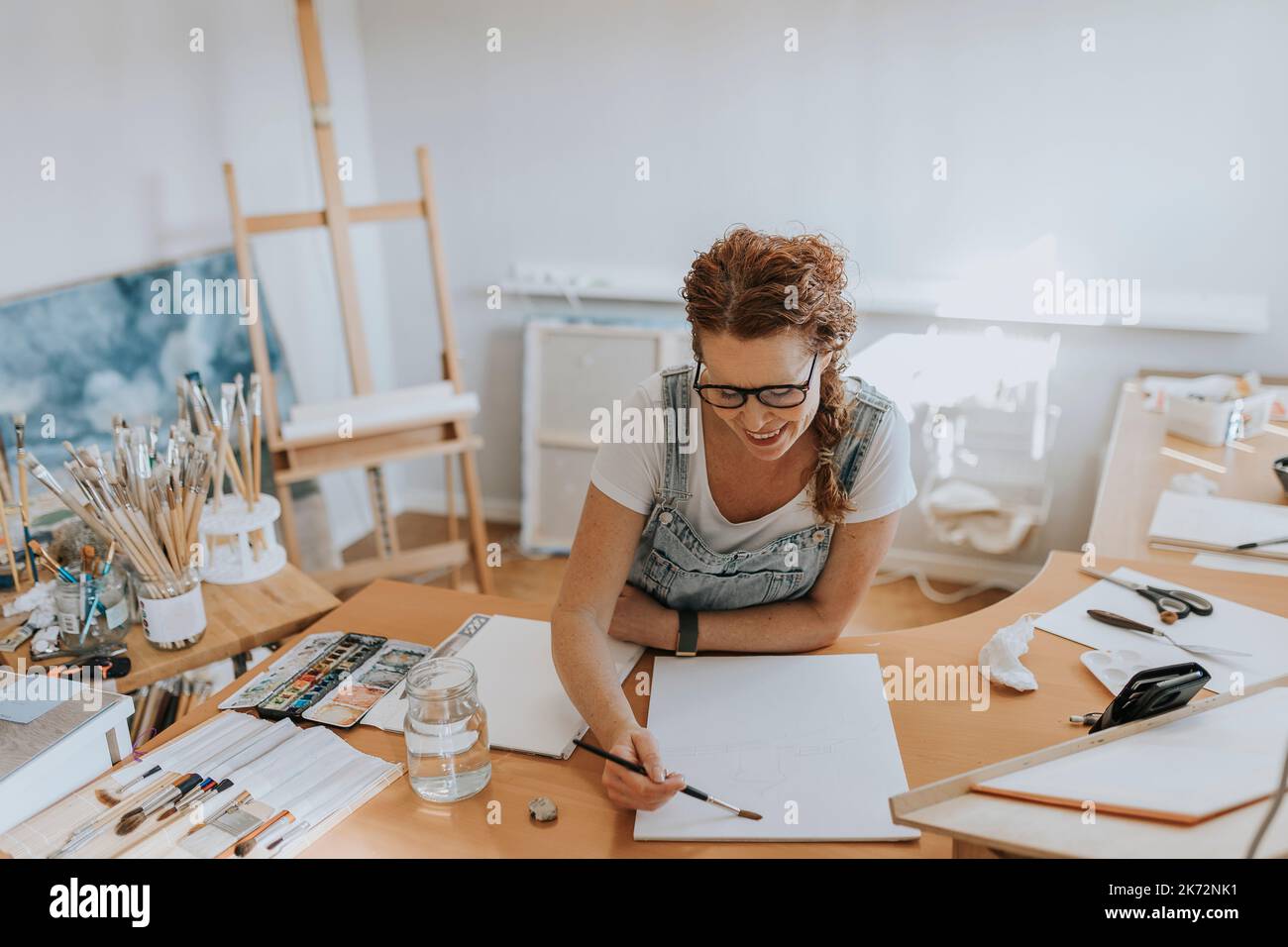 Artist painting in studio Stock Photo - Alamy