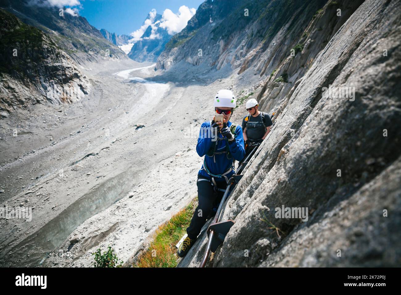 Climbers exploring mountains Stock Photo - Alamy