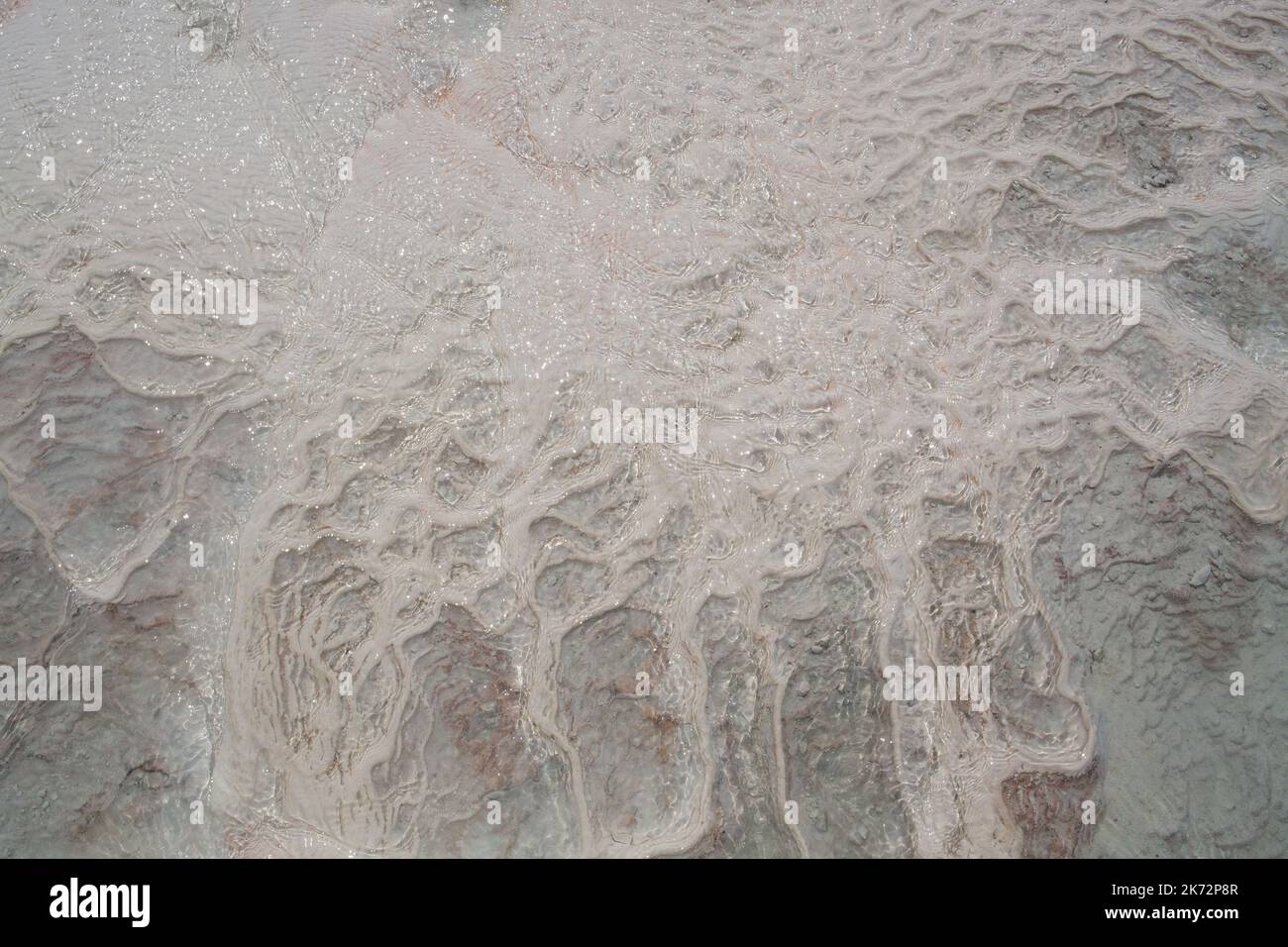 Limestone floor with water in Pamukkale calcium travertine in Turkey ...