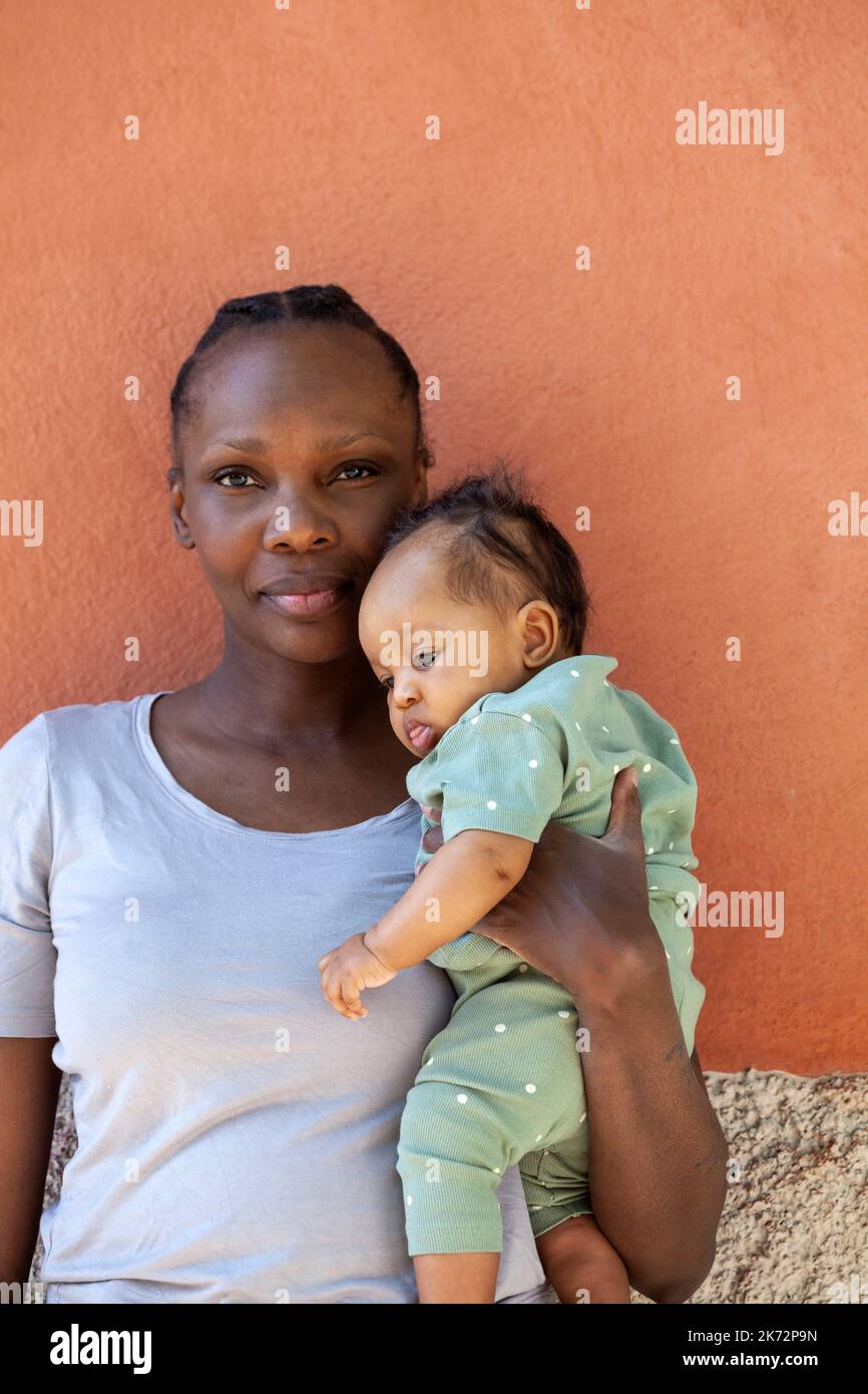 Mother holding baby Stock Photo - Alamy