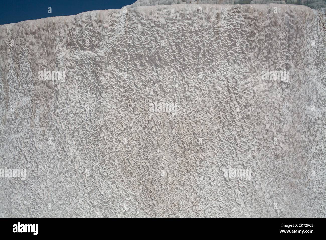 Background of natural white wall Pamukkale calcium travertine in Turkey ...