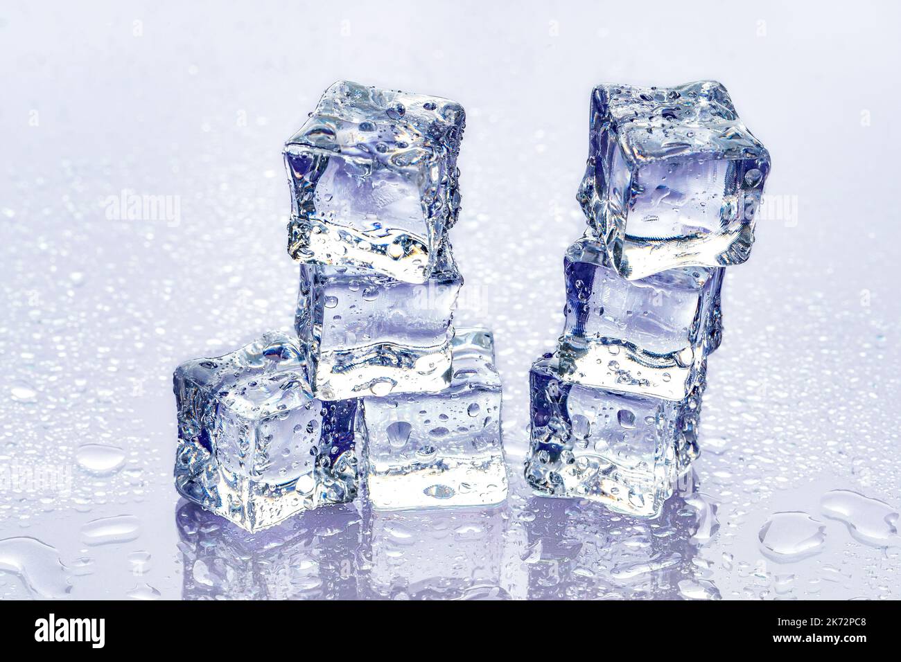 ice cubes on blue background Stock Photo - Alamy