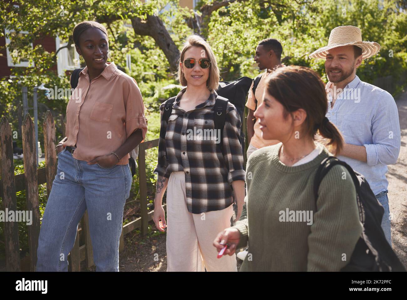 Friends walking together Stock Photo - Alamy