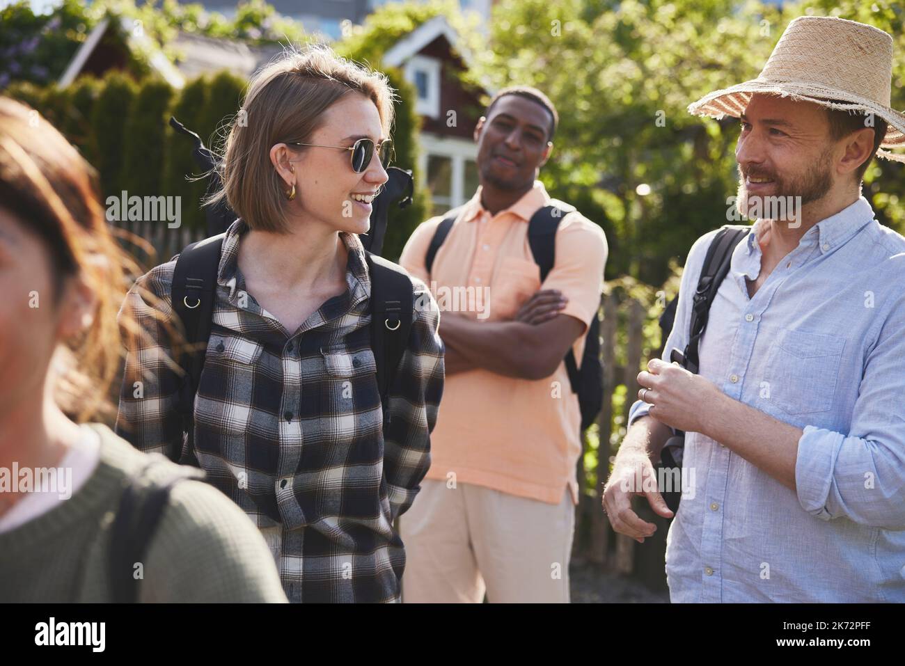 Friends talking together Stock Photo - Alamy
