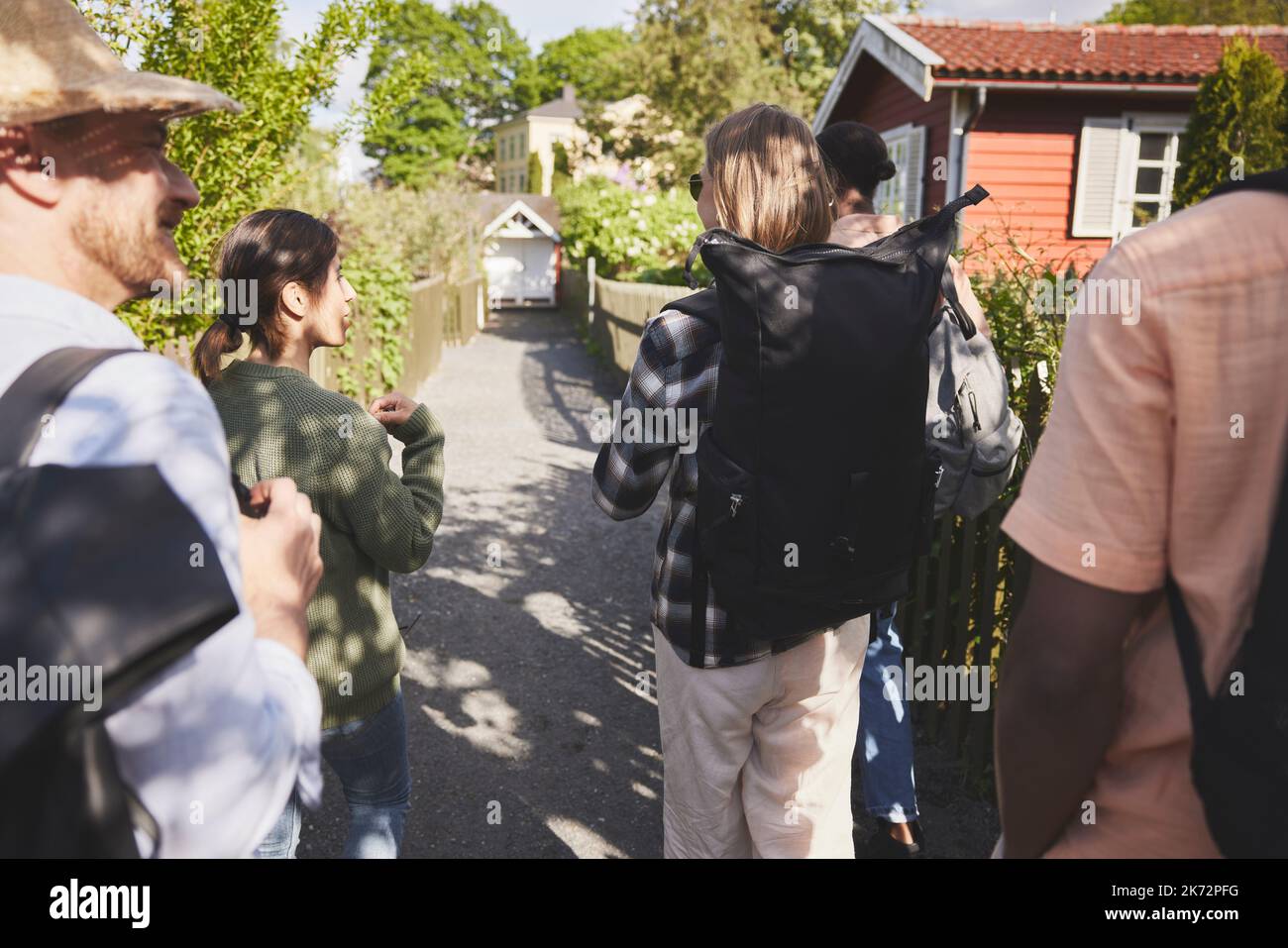 Friends walking together Stock Photo - Alamy