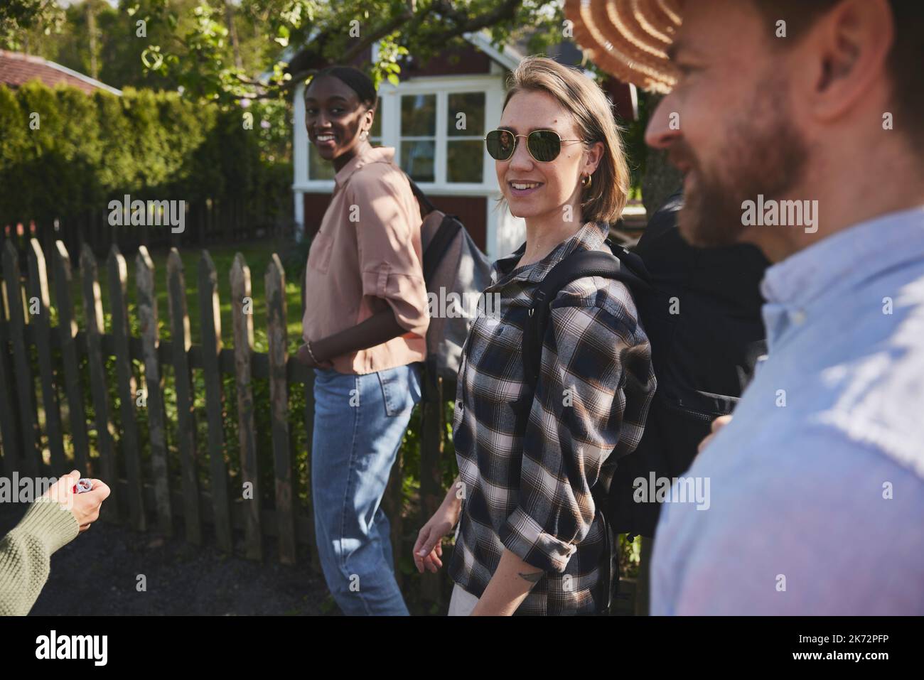 Friends walking together Stock Photo - Alamy