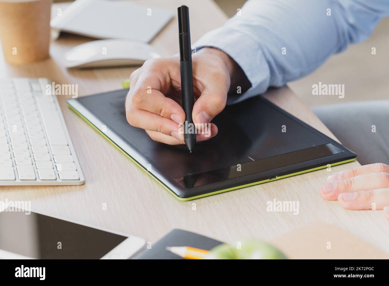 graphic designer using a pen tablet Stock Photo - Alamy