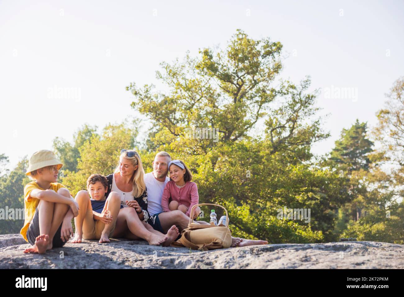 Family relaxing at sea Stock Photo - Alamy