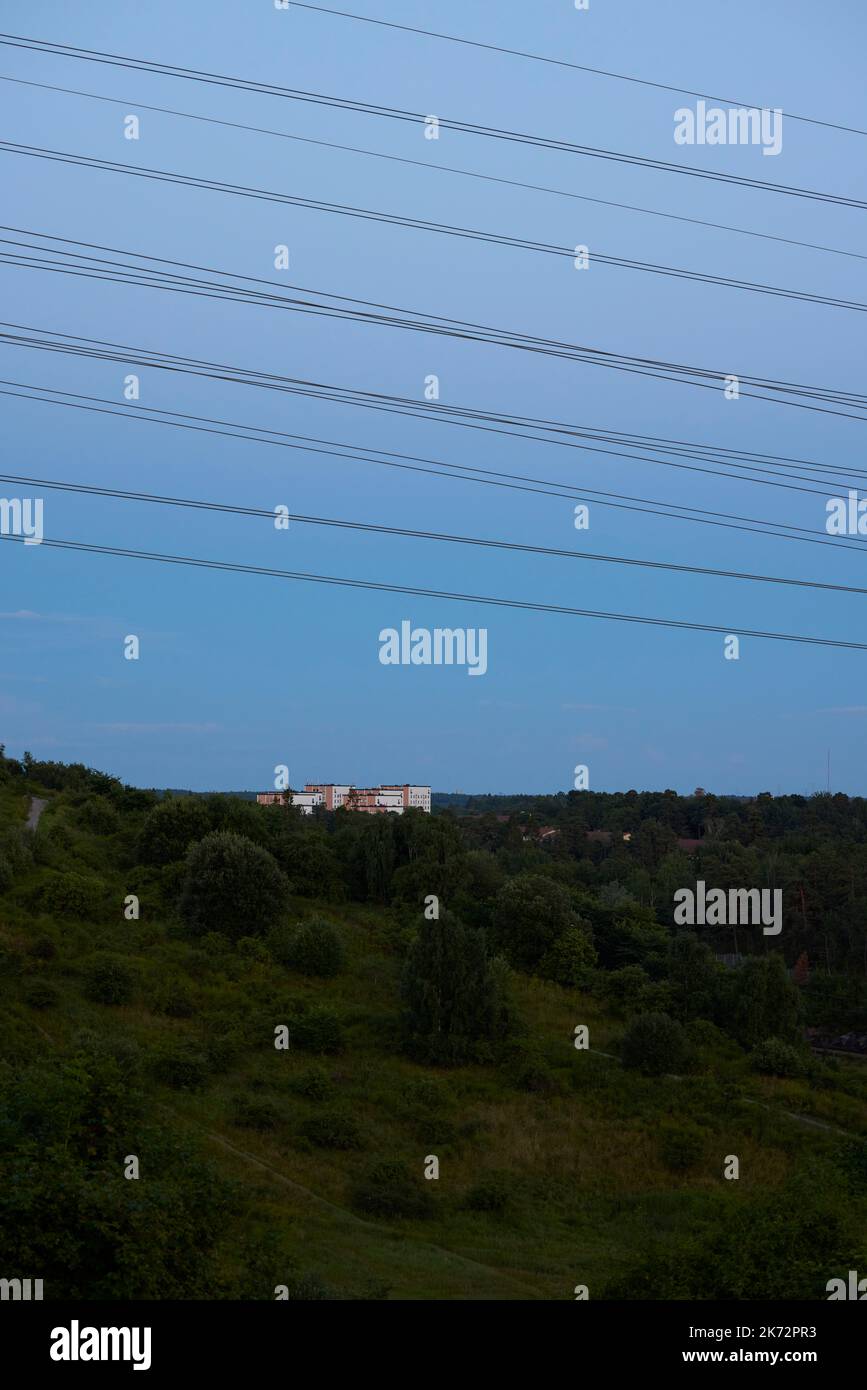 Electricity cables against sky Stock Photo - Alamy