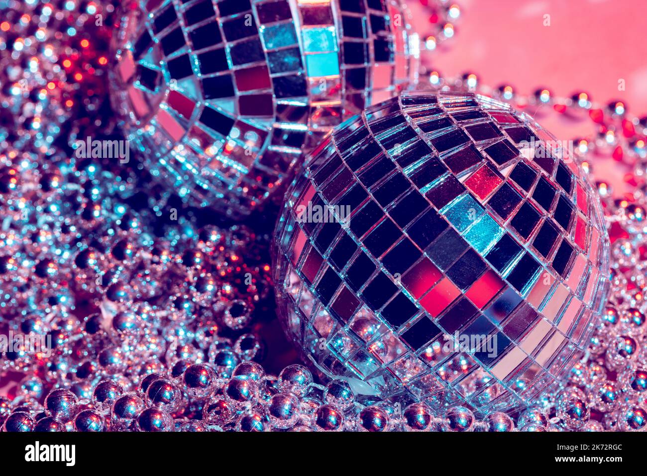 disco balls for decorationof a party on pink background Stock Photo - Alamy