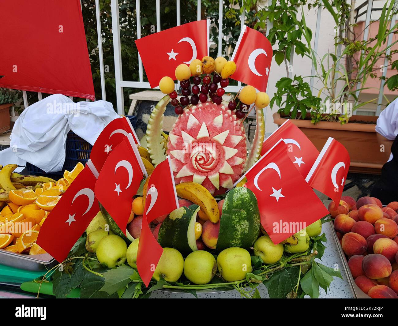 Fresh summer fruits in a watermelon basket decorated with Turkish flags ...