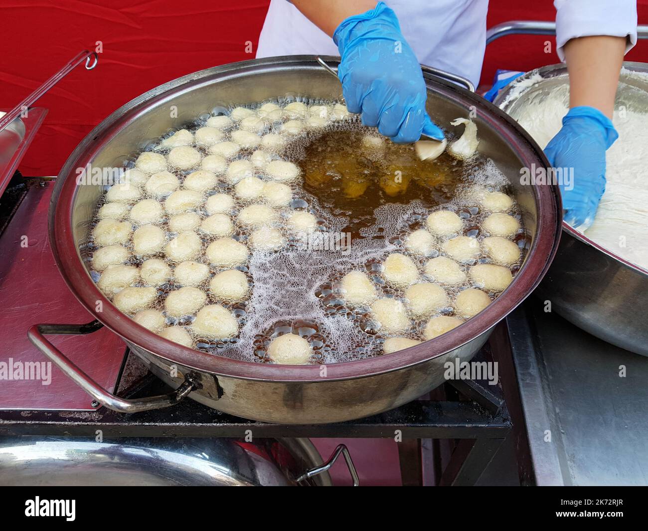 Cooking fry curd balls in boiling hot oil. Turkish donuts Lokma Stock ...