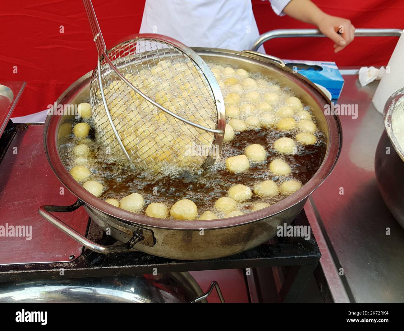 Cooking fry curd balls in boiling hot oil. Turkish donuts Lokma Stock ...