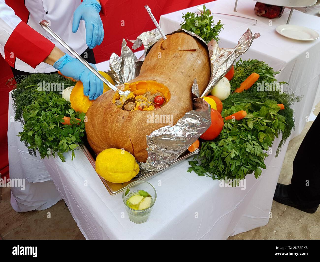 Baked pumpkin stuffed with rice, meat and vegetables. Turkish national ...