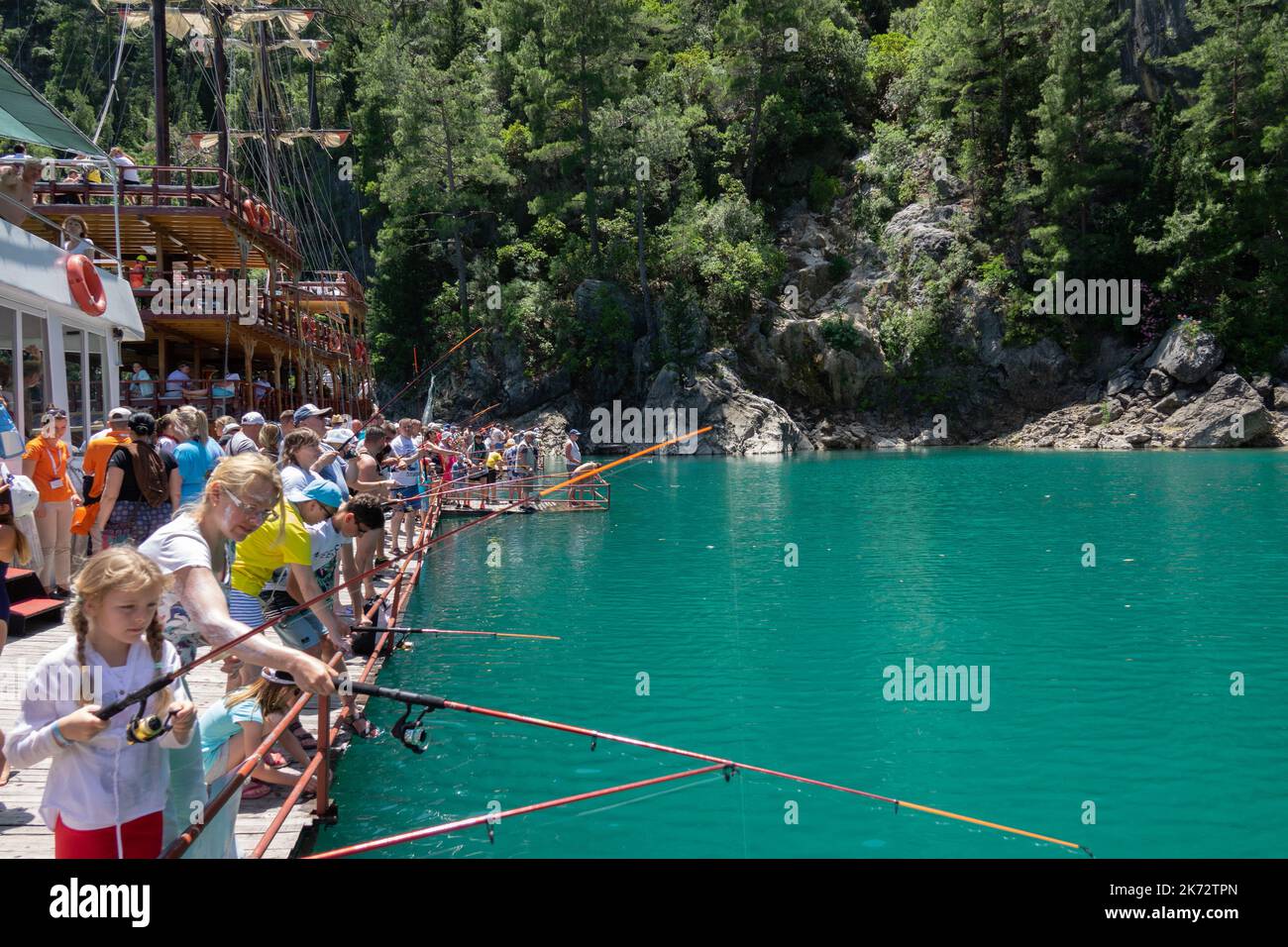 Manavgat, Turkey - June 05, 2019: Tourists fishing in the lake near the ...
