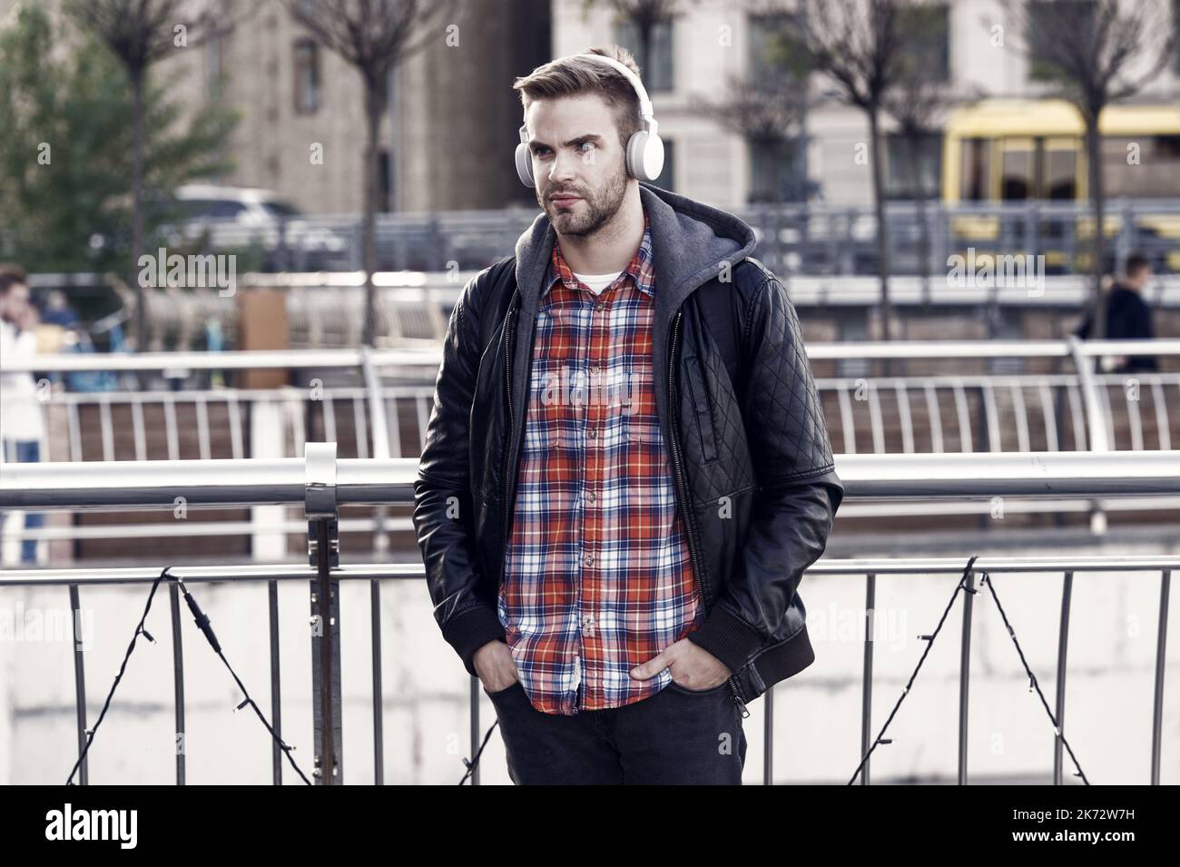 Deliver perfect audio reproduction. Young man wear audio headphones ...