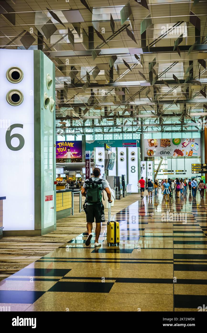 Tourist moving toward Check-In counter in Departure Hall, Changi ...