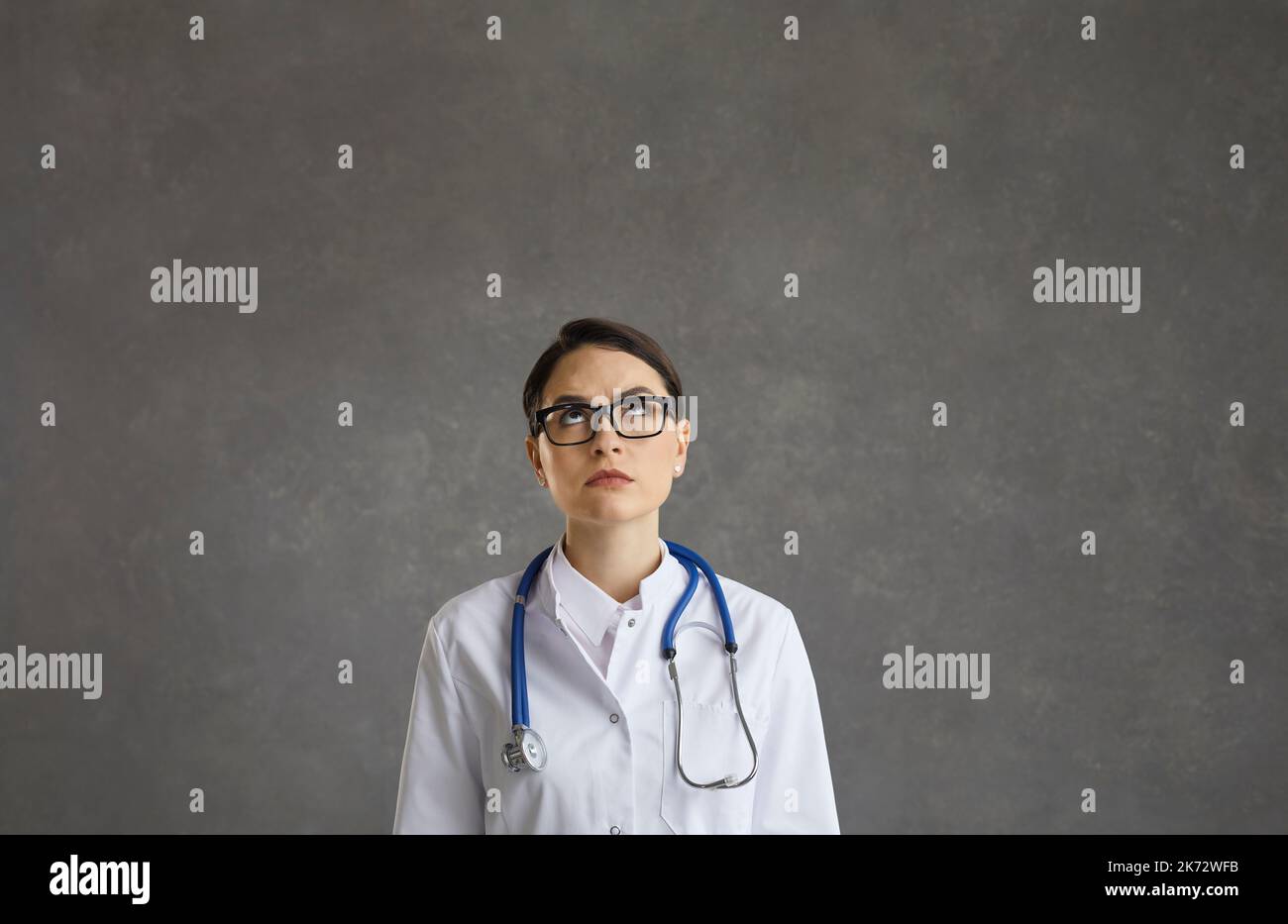 Reflective thinking nurse hi-res stock photography and images - Alamy