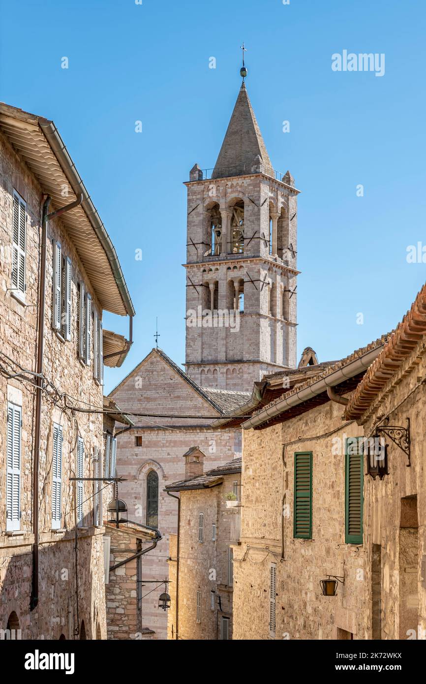 The bell tower of the basilica of Santa Chiara framed by the buildings ...