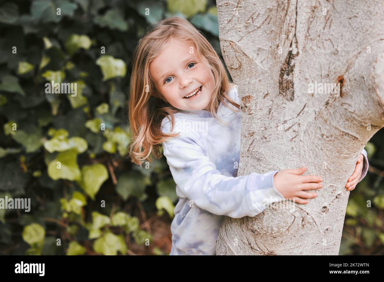 Hold on tight with all your mite. an adorable little girl hugging a ...