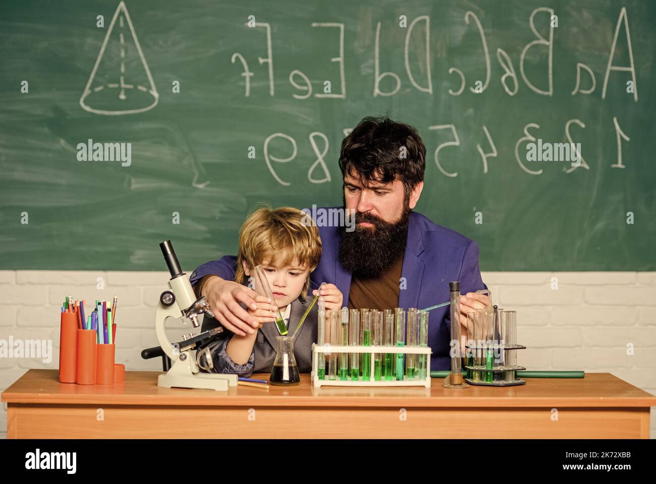 Back to school. Scientist research and experiments father and son at ...