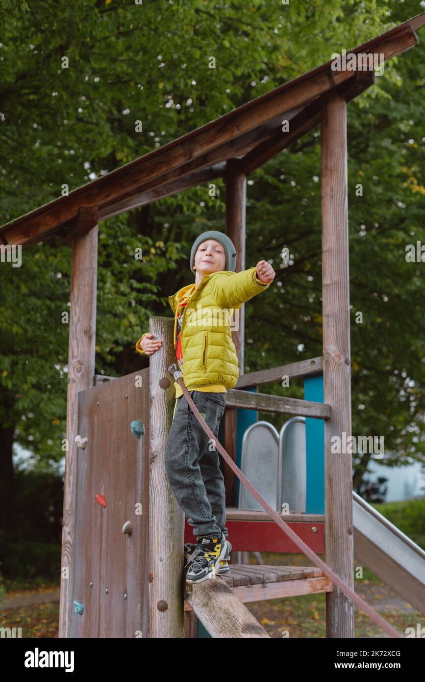 Funny cute happy baby playing on the playground. The emotion of ...