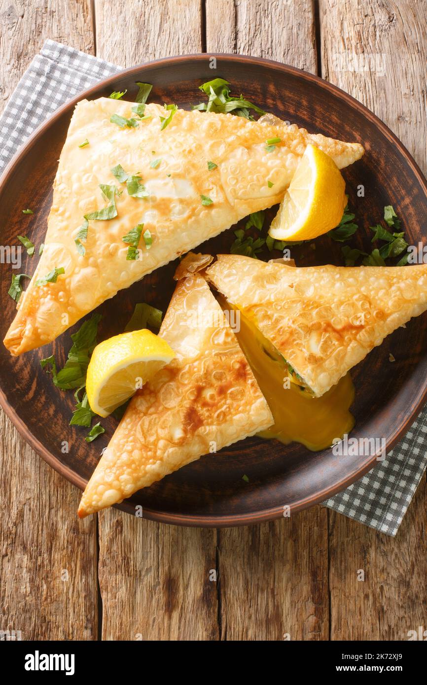 Traditional Tunisian cuisine Brik pastries with tuna and egg srved with ...