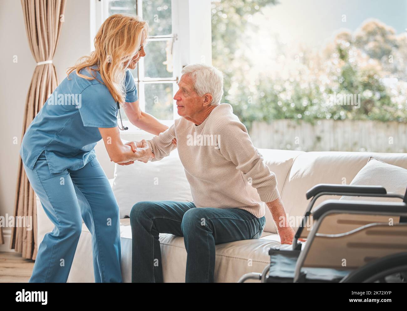Nurse helping elderly male patient hi-res stock photography and images ...