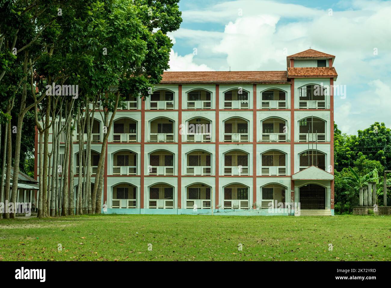 The nice building behind trees and the benefit of preserving trees is ...