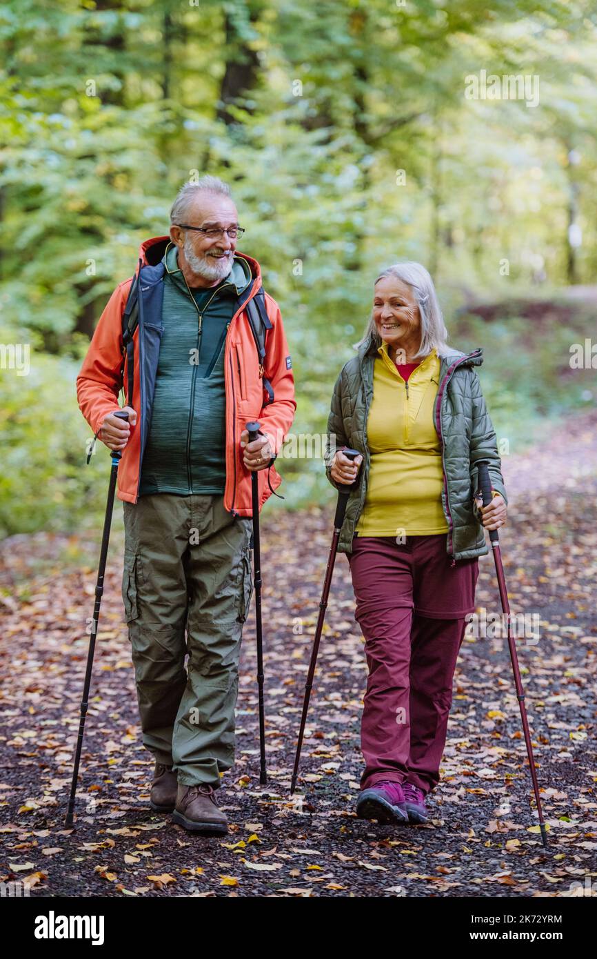 Older couple hiking in forest hi-res stock photography and images - Alamy