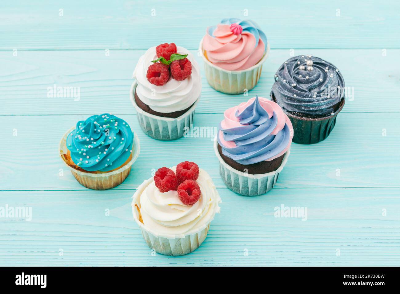 delicious cupcakes on a colored background. Festive background ...