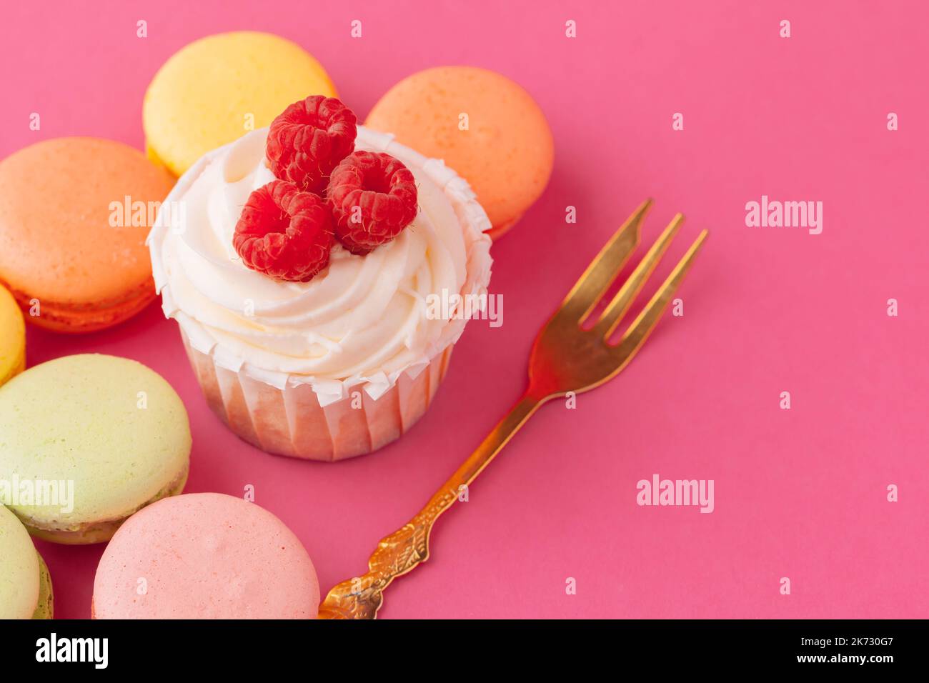 Yummy sweet cupcakes on light pink background Stock Photo - Alamy