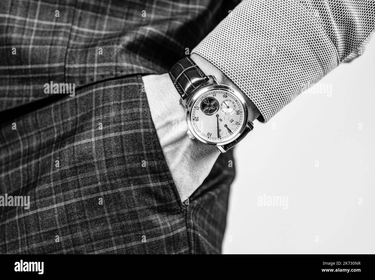 Analog wrist watch worn on male arm in trousers pocket, wristwatch ...