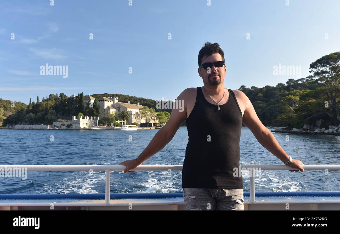 Man on the deck of a cruise ship Stock Photo - Alamy
