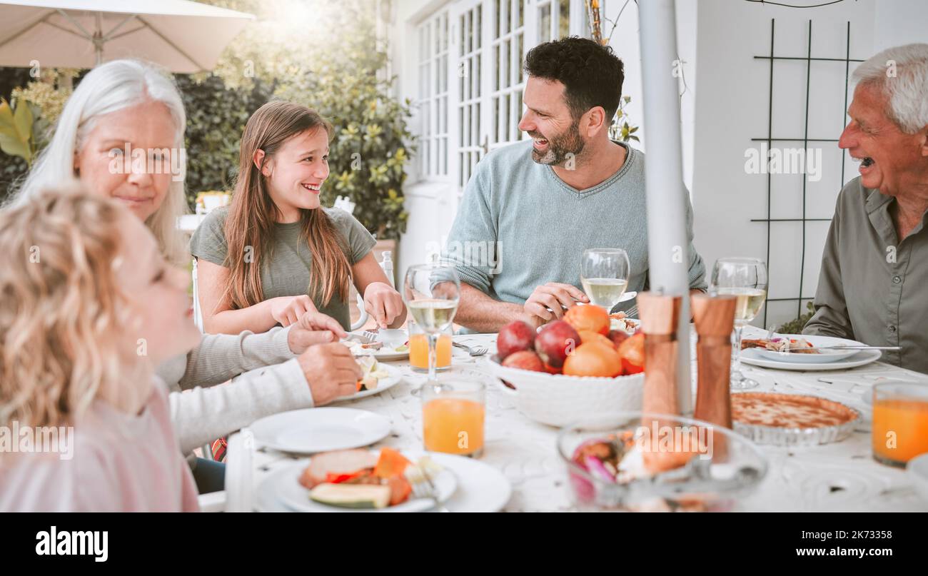 Our most basic instinct is for family. a family having lunch outside ...