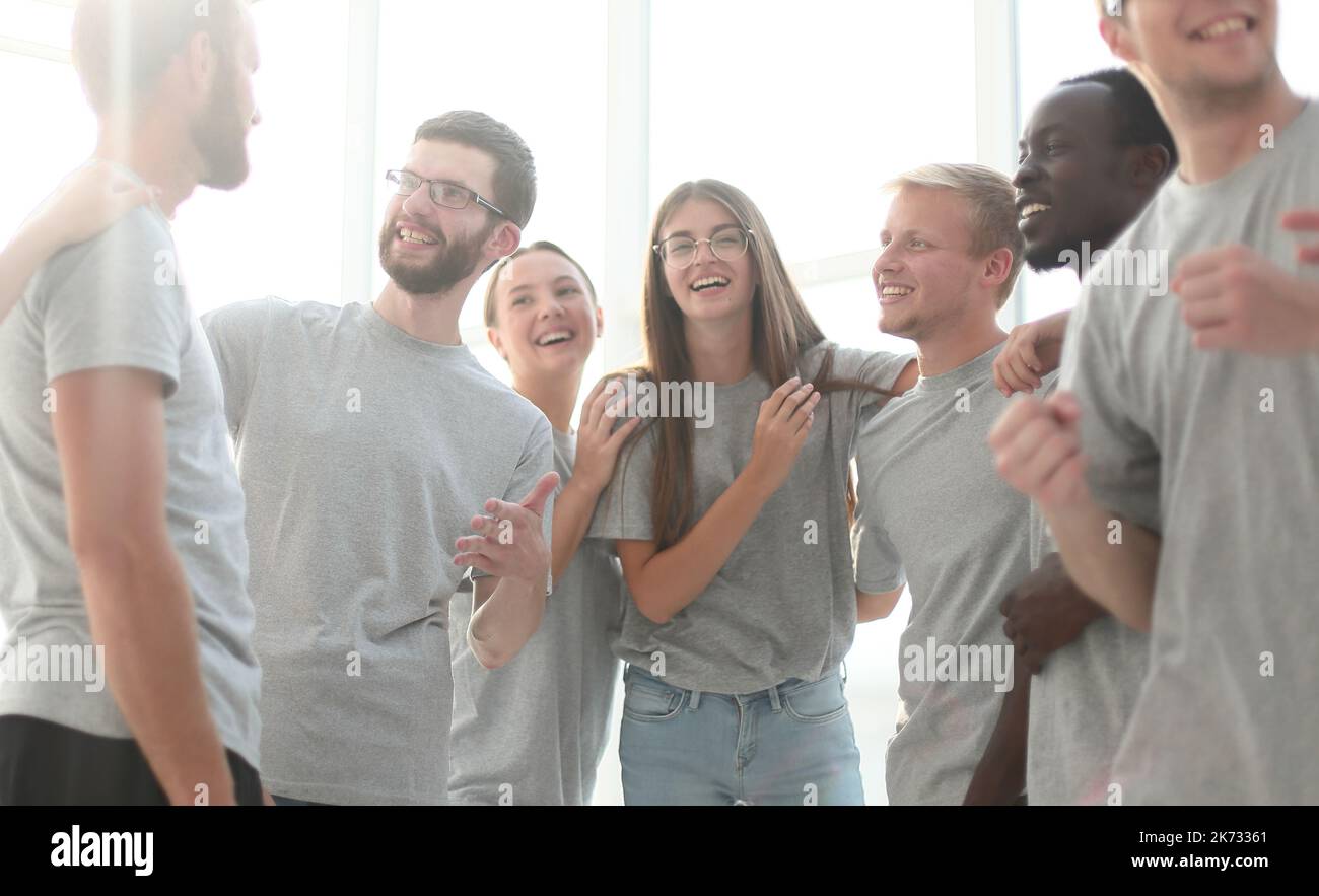 group of diverse young men in grey t-shirts standing together Stock ...