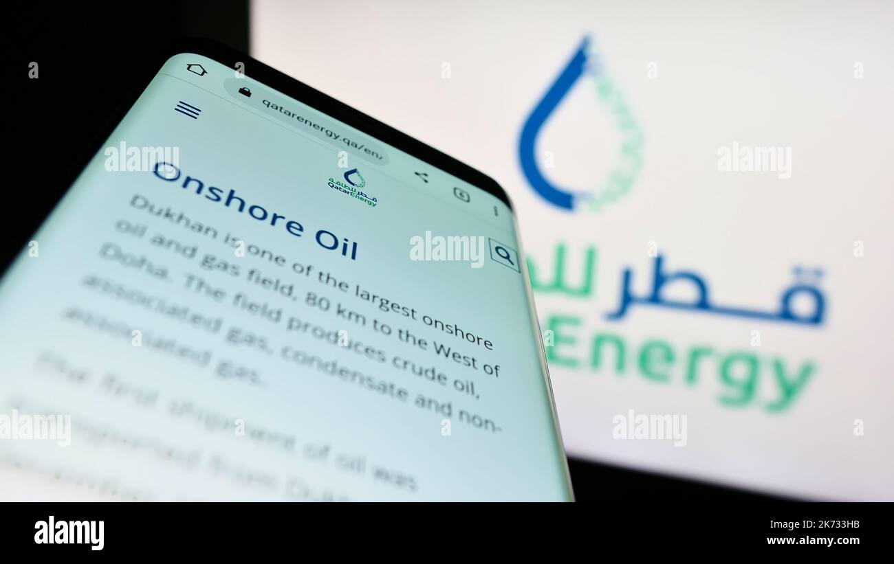 Mobile phone with website of Qatari petroleum company QatarEnergy on ...