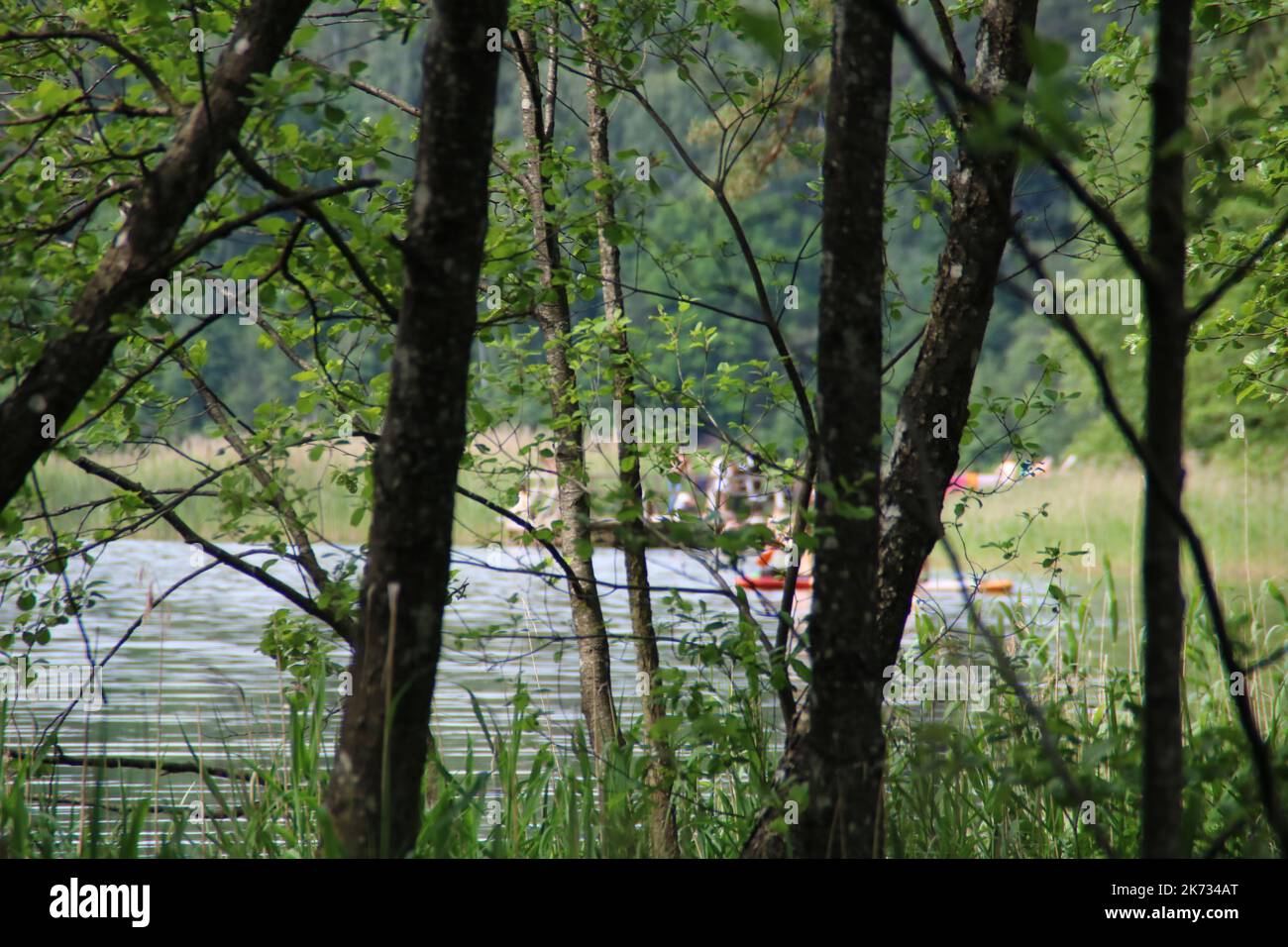 beautiful scenery, a beautiful lake with green water and happy people ...