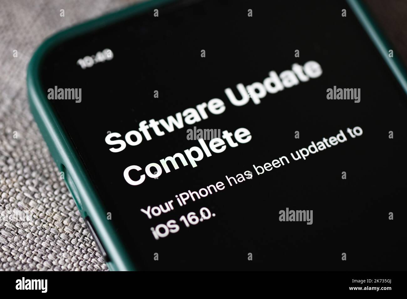 iPhone with iOS 16 Software Update Complete on the screen close up, new ...