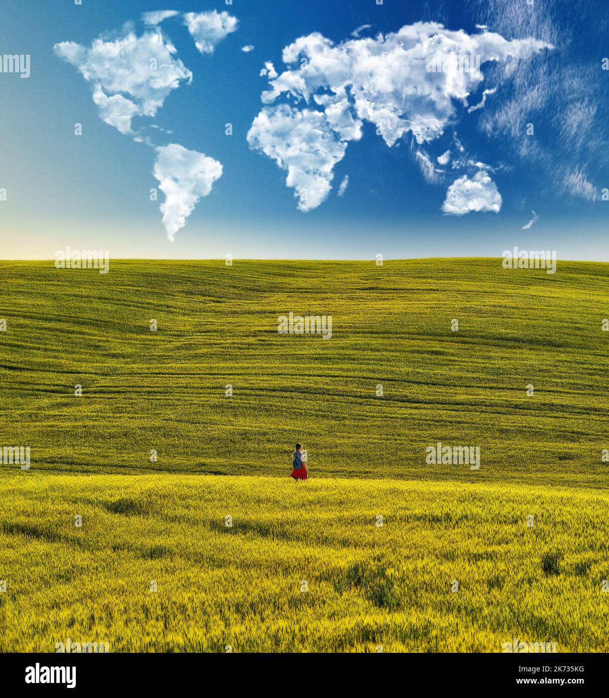 clouds in the form of a map of the world over a hilly field. tourist ...