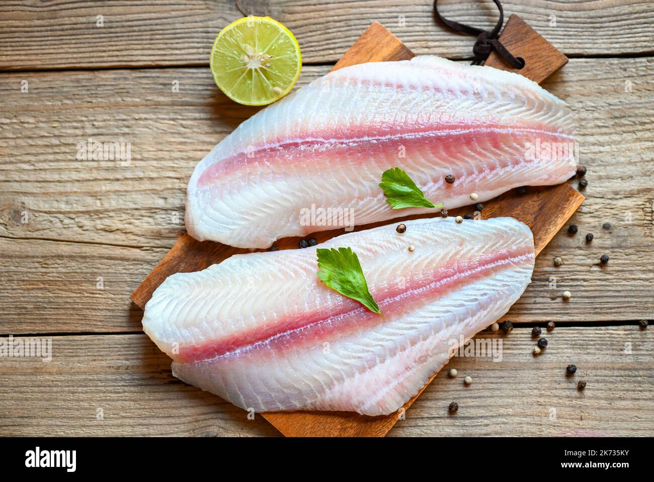 Meat dolly fish tilapia striped catfish, fish fillet on wooden board ...