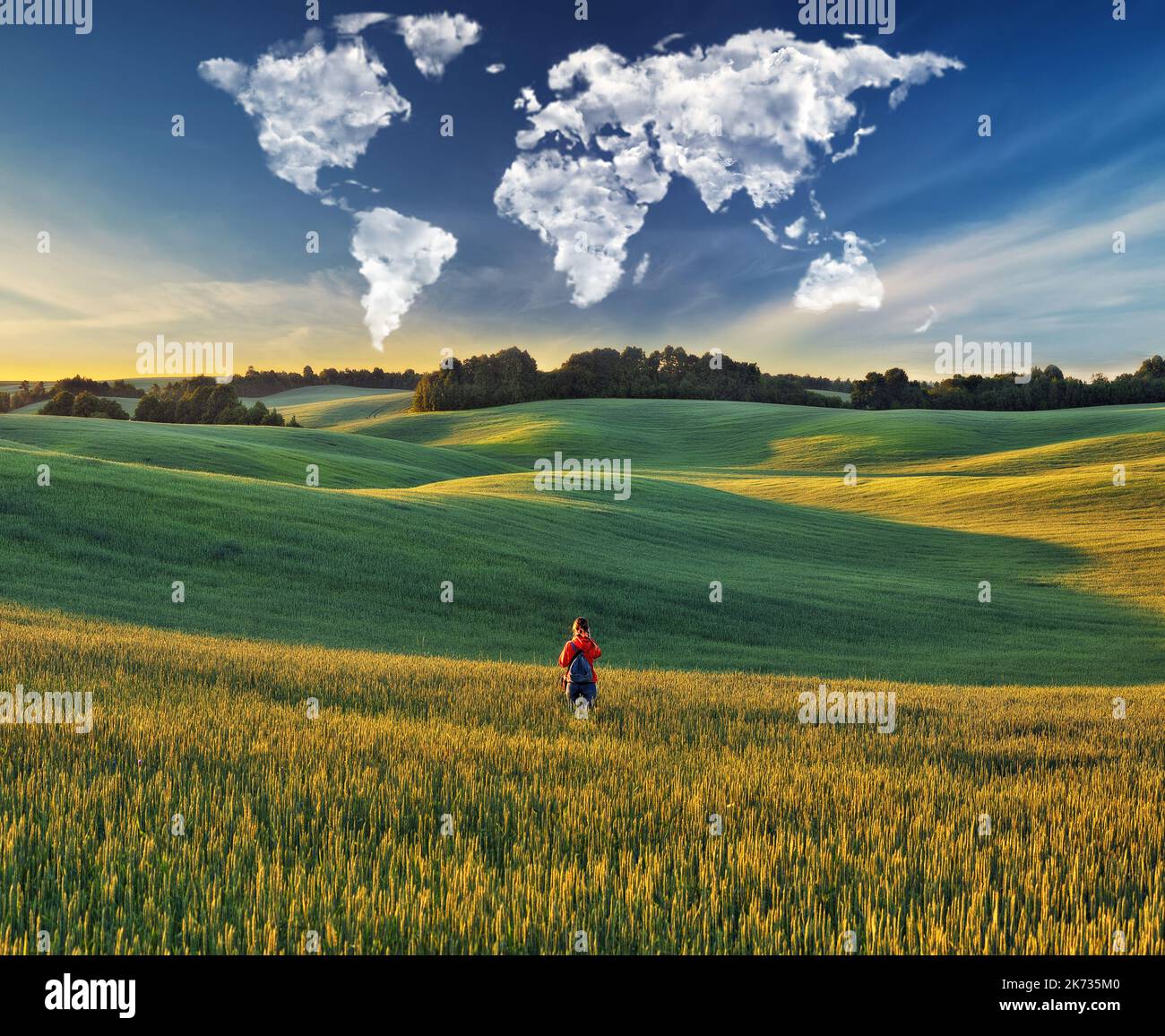 clouds in the form of a map of the world over a hilly field. tourist ...