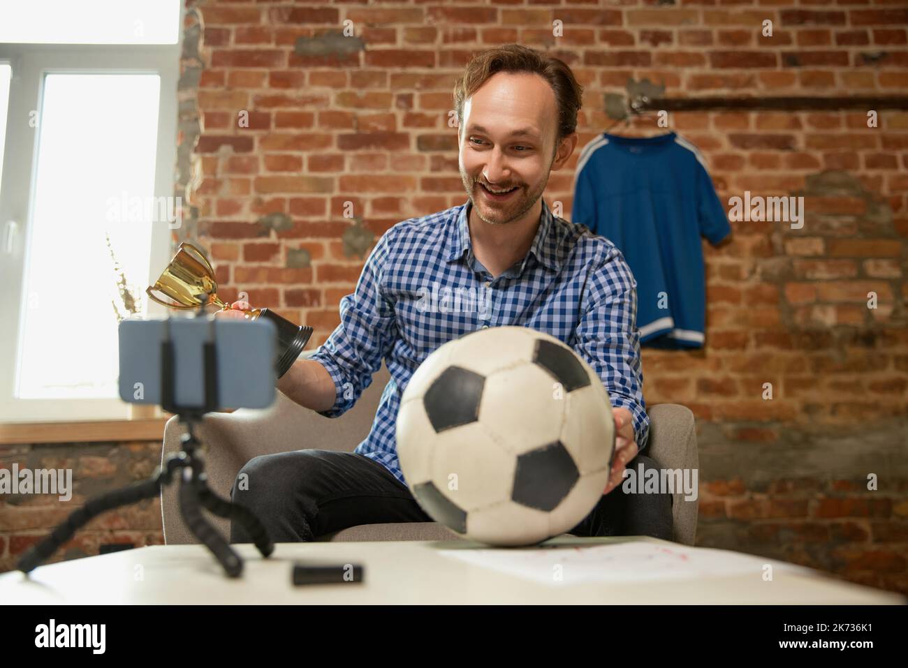 Winner emotions. Happy man, soccer fan recording vlog about last ...