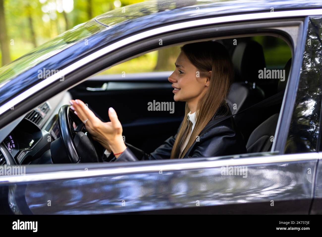 Beautiful angry woman honking in her car while driving Stock Photo - Alamy