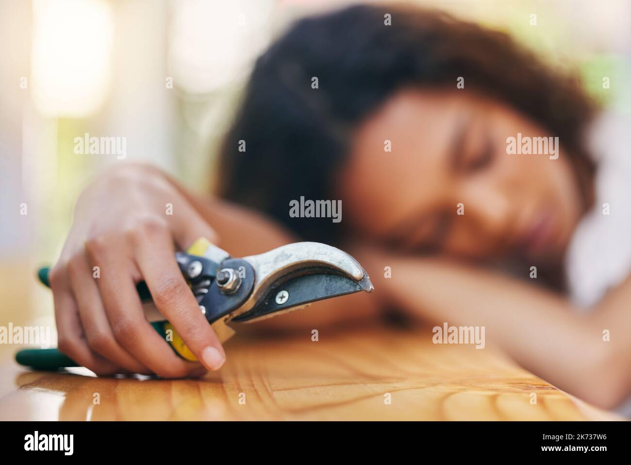 Be careful when using sharp objects. a tired nursery owner taking a ...