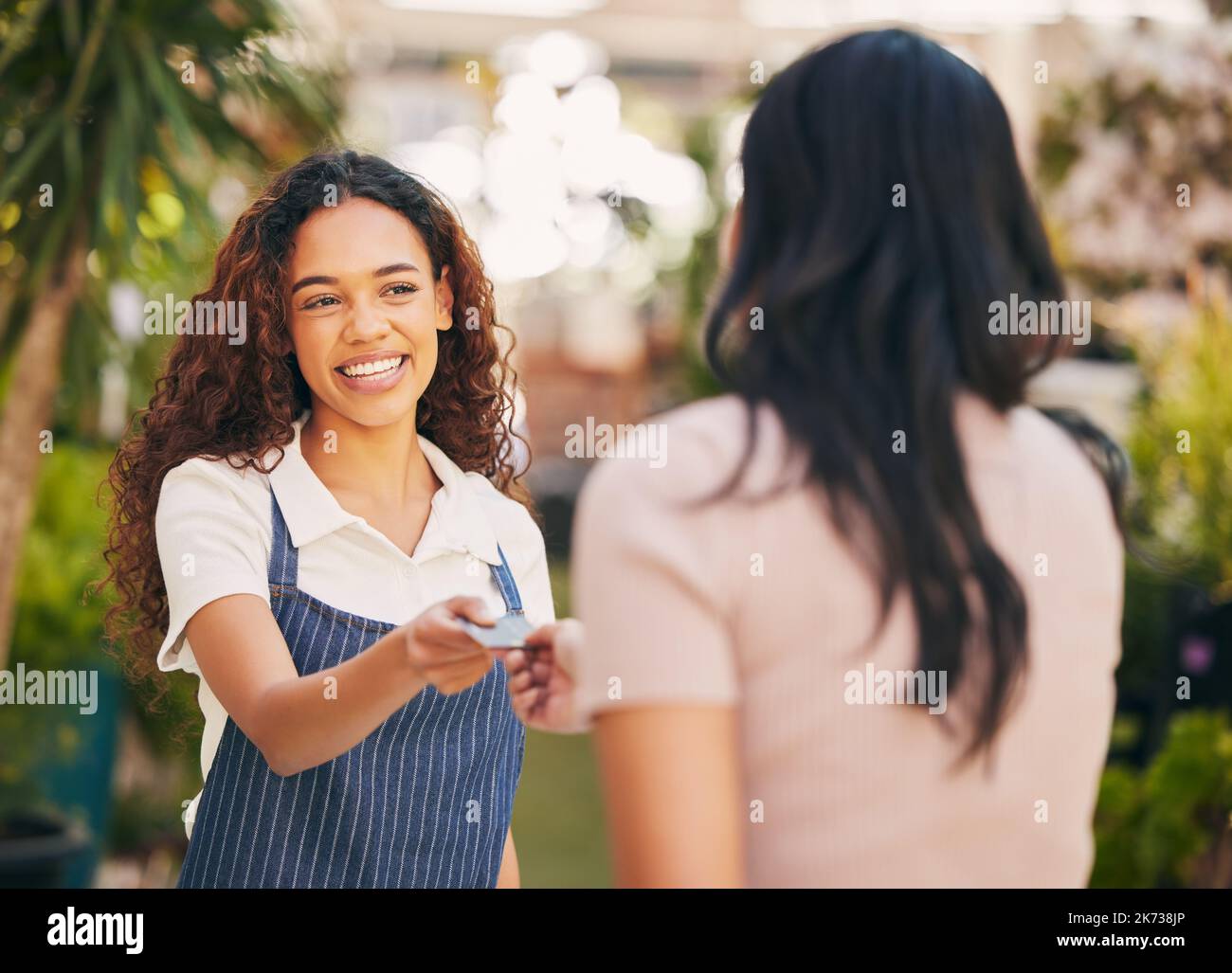 Cant wait for you to visit again. a customer using a card to make a ...