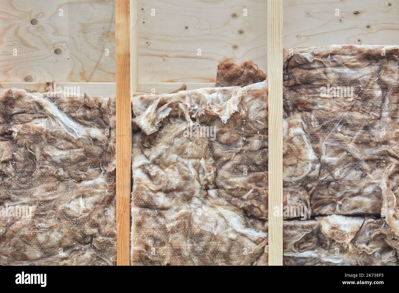 Insulation of a Dutch wall with natural sheep wool Stock Photo - Alamy