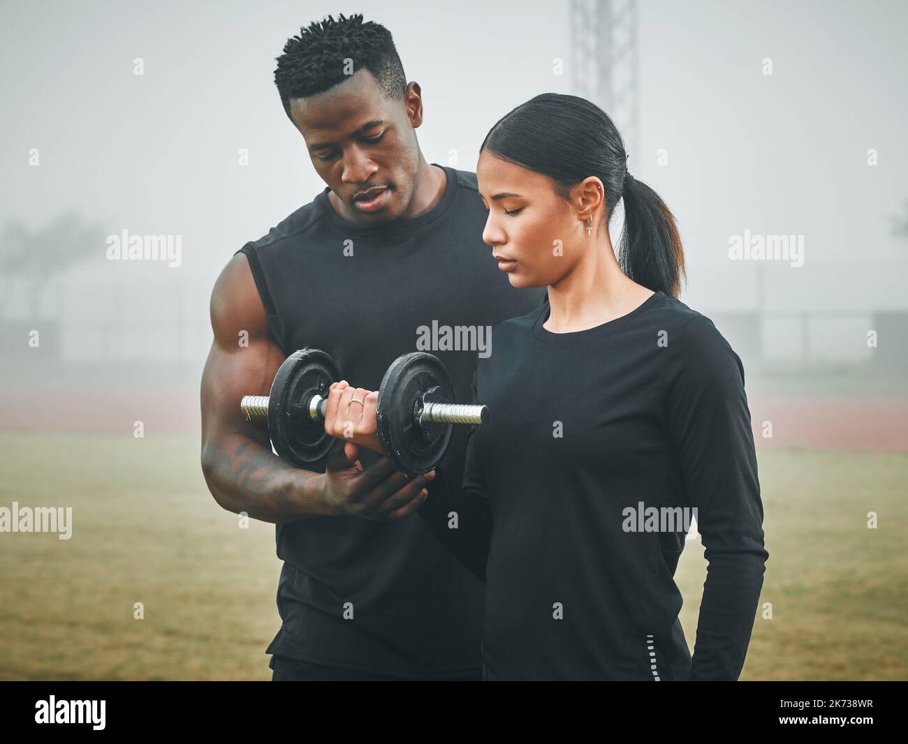 It takes hard work to maintain good form. a sporty young woman ...