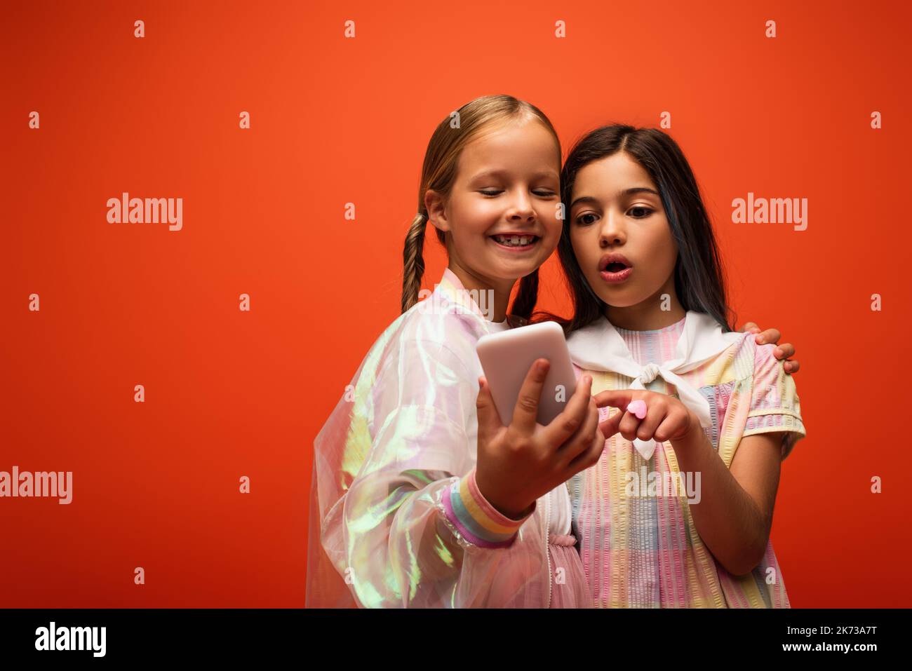 Smiling friends finger pointing dress hi-res stock photography and ...