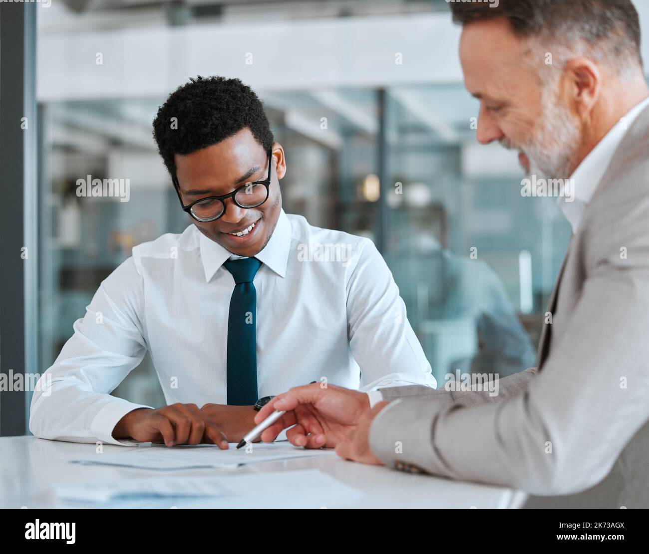 Two people signing business contract hi-res stock photography and ...